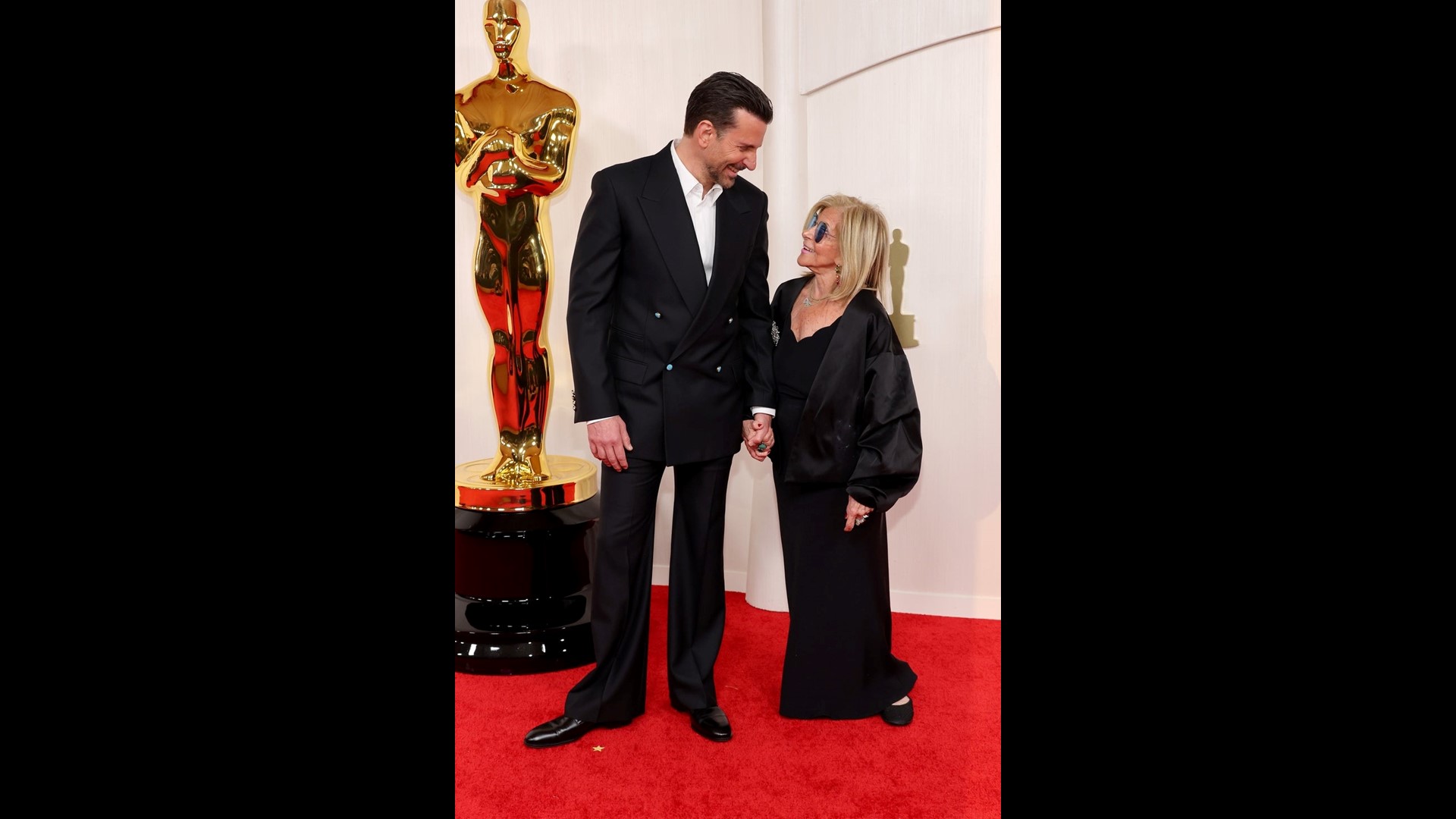 Bradley Cooper Hits the 2024 Oscars Red Carpet With His Mom Gloria ...