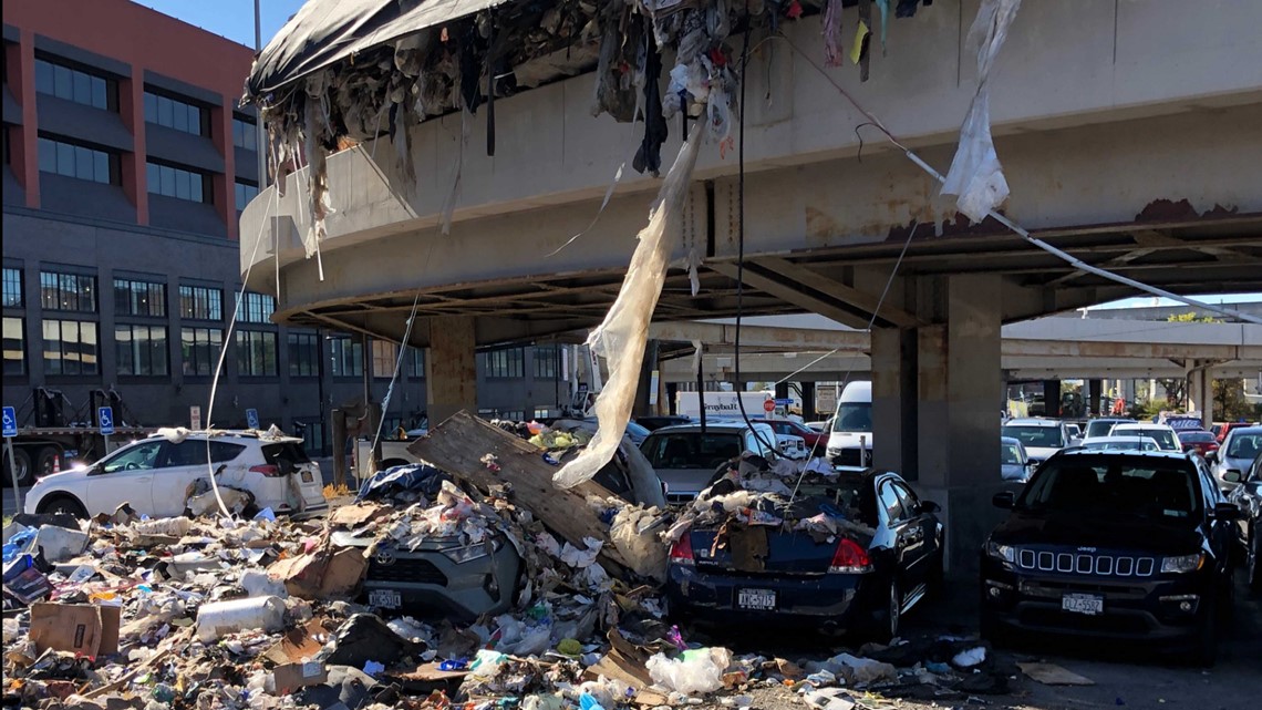 Garbage truck overturns on Route 5EB ramp to the I-190N; driver is ...