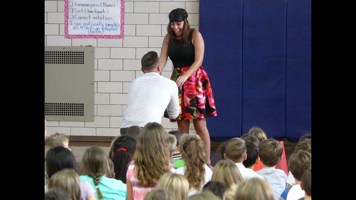 Teachers get engaged at school assembly | wgrz.com
