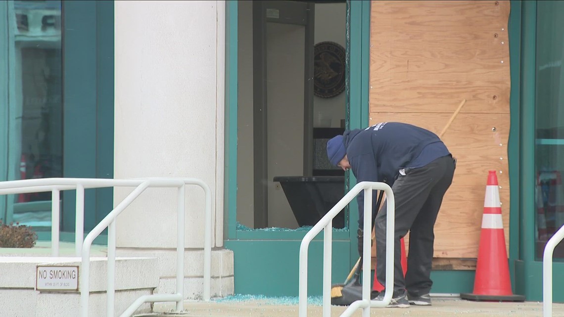 Man arrested after a rock was thrown through the front glass door of ...