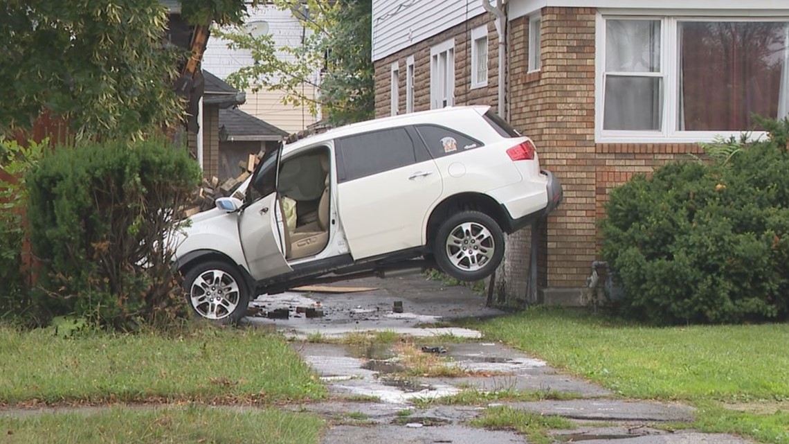 Car hits houses after driver suffers from suspected medical condition ...