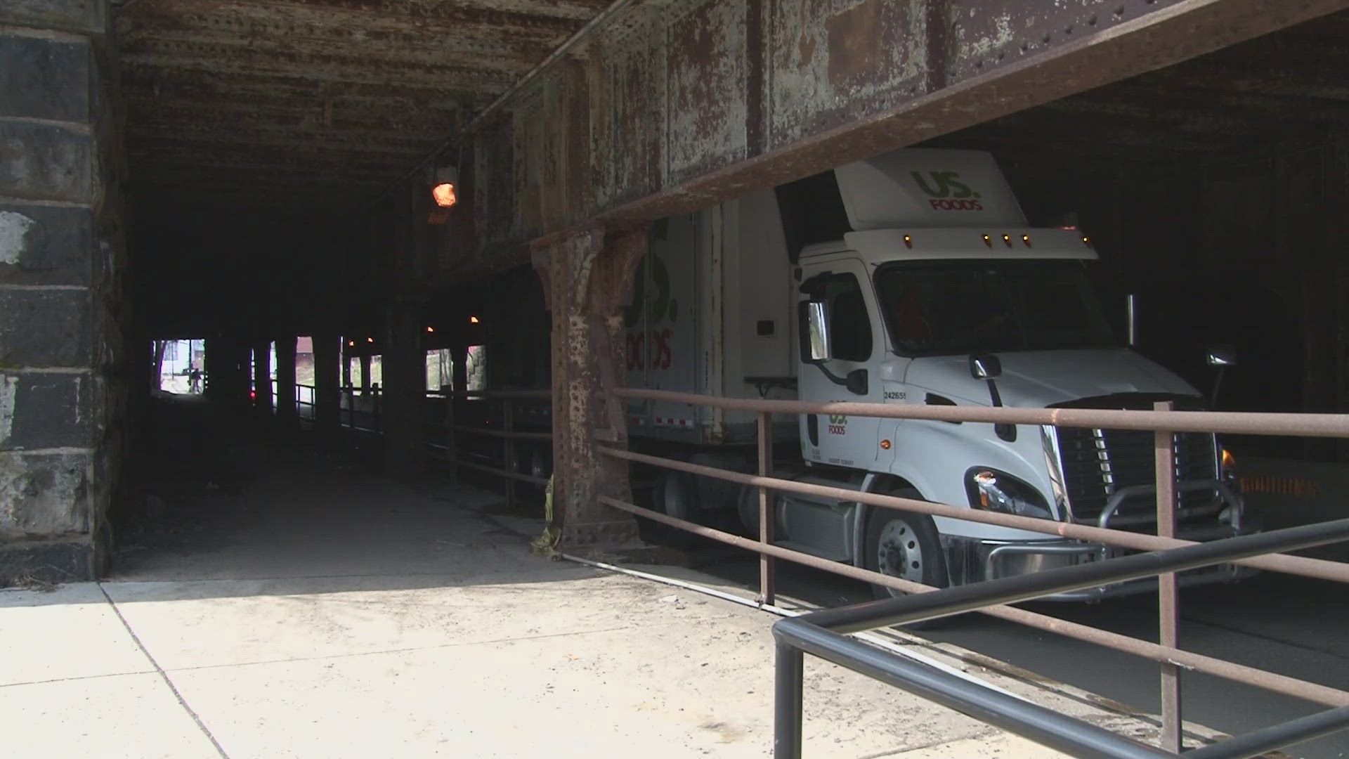 Semi-truck stuck under bridge on William Street | wgrz.com