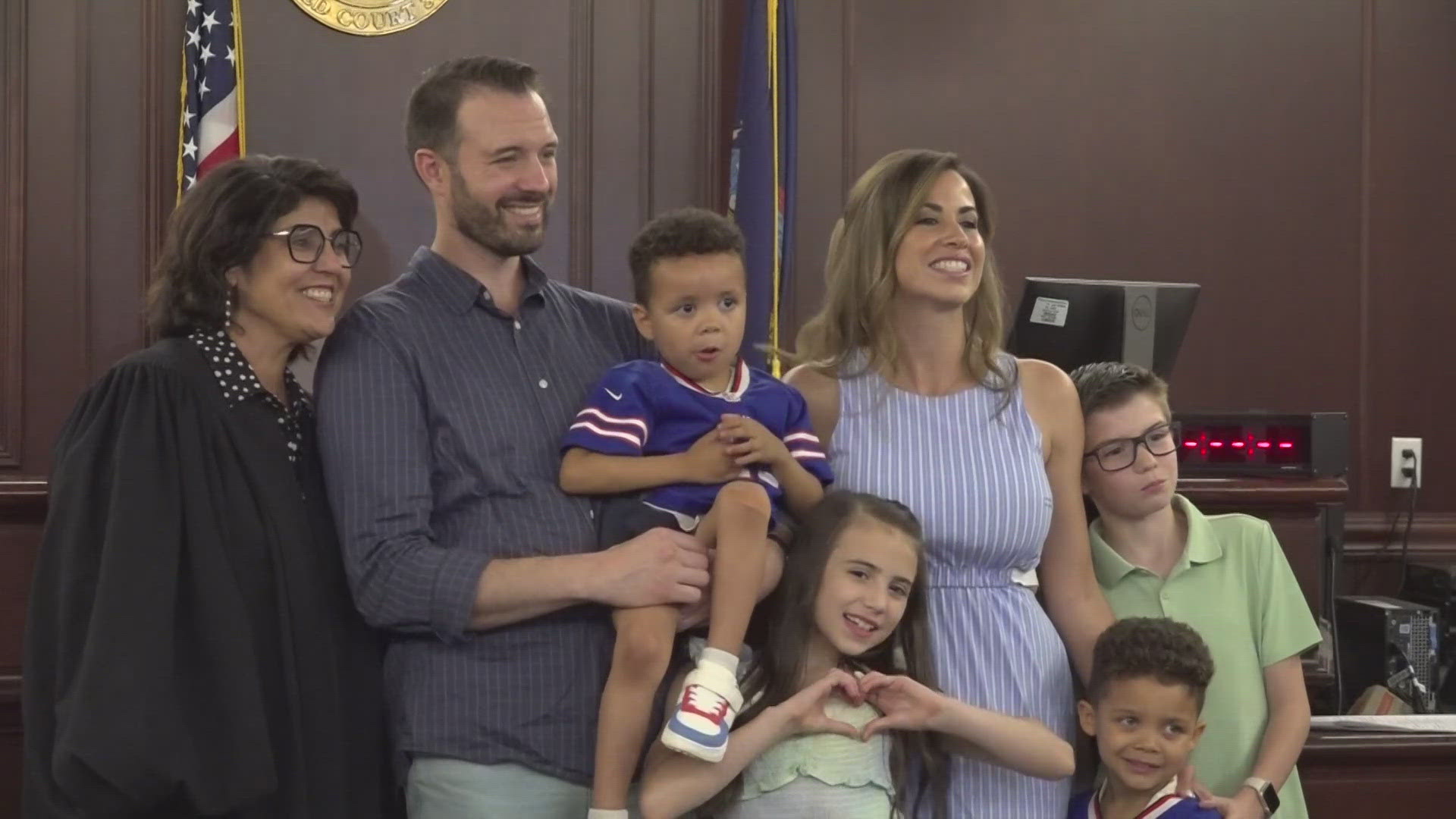 Buffalo family adopts two boys in emotional celebration | wgrz.com