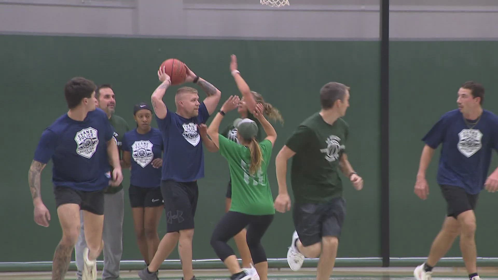 Police and educators face off in basketball game to help local families ...