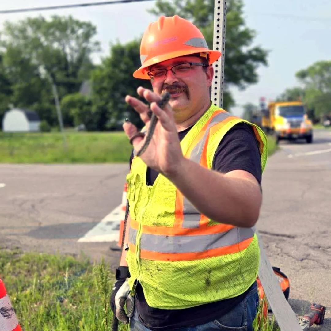 NYSDOT workers safely relocate small snake during road repairs | wgrz.com