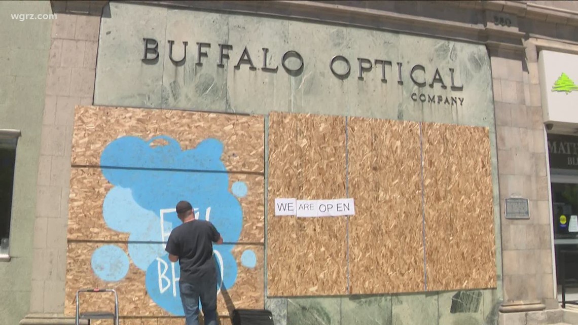 Local artist beautifies boarded up windows at Buffalo Optical | wgrz.com